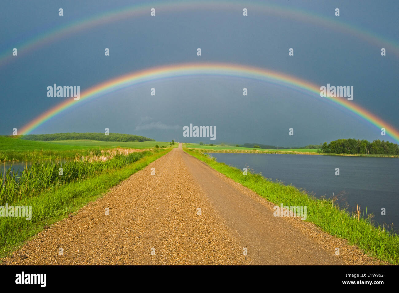 Road through farmland and prairie slough hi-res stock photography and ...
