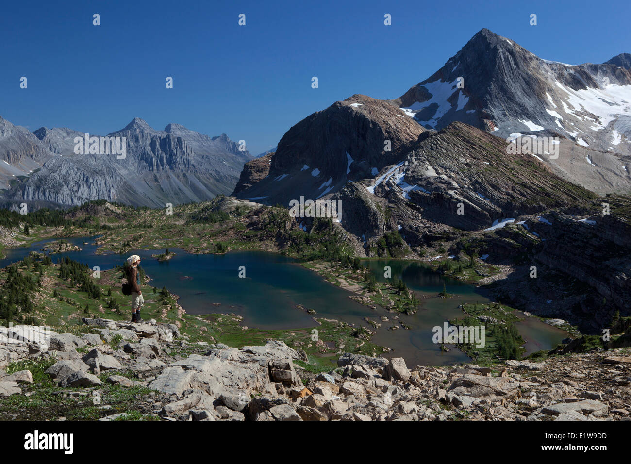 Hiker above Limestone Lakes Mount Marconi Mount Minton Russell Peak ...