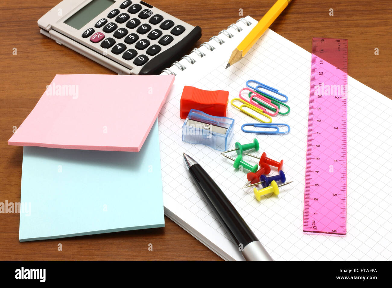 Stationery objects on a wooden background Stock Photo - Alamy