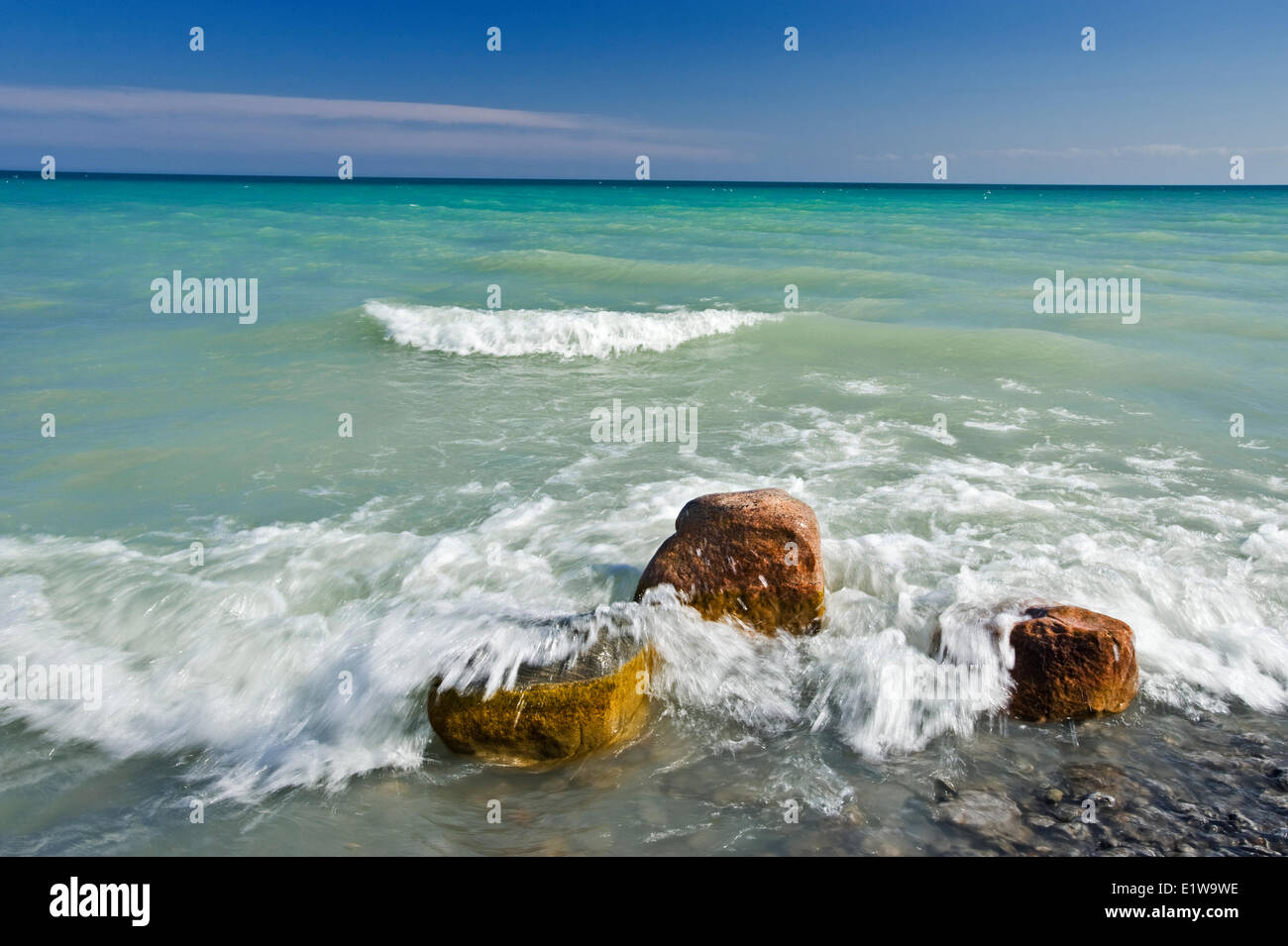 Waves lapping over rocks on Lake Ontario, Presqu' ile Provincial Park ...