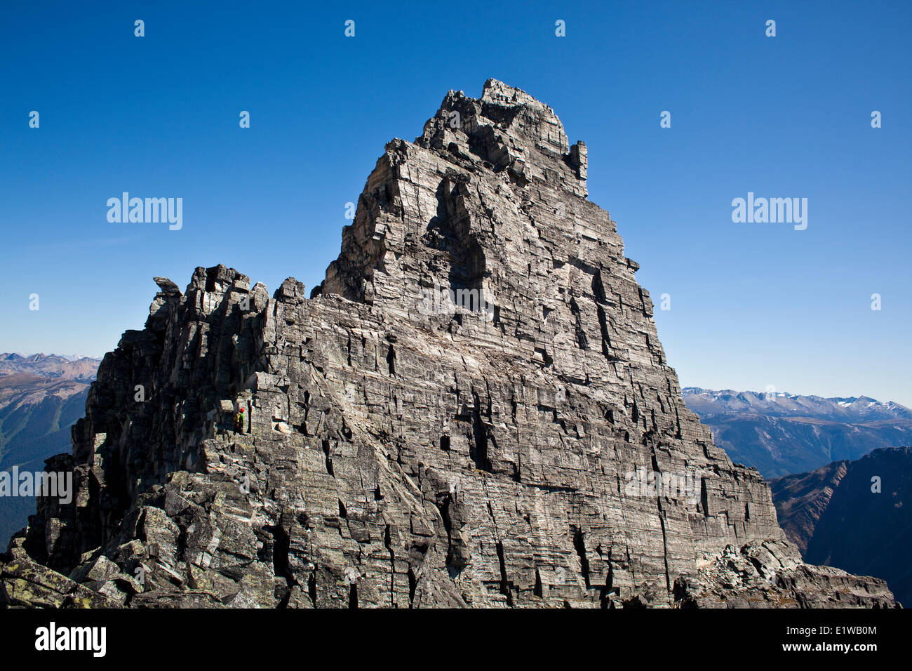 A young man alpine climbing the west ridge of Mt Tupper, Roger's Pass ...