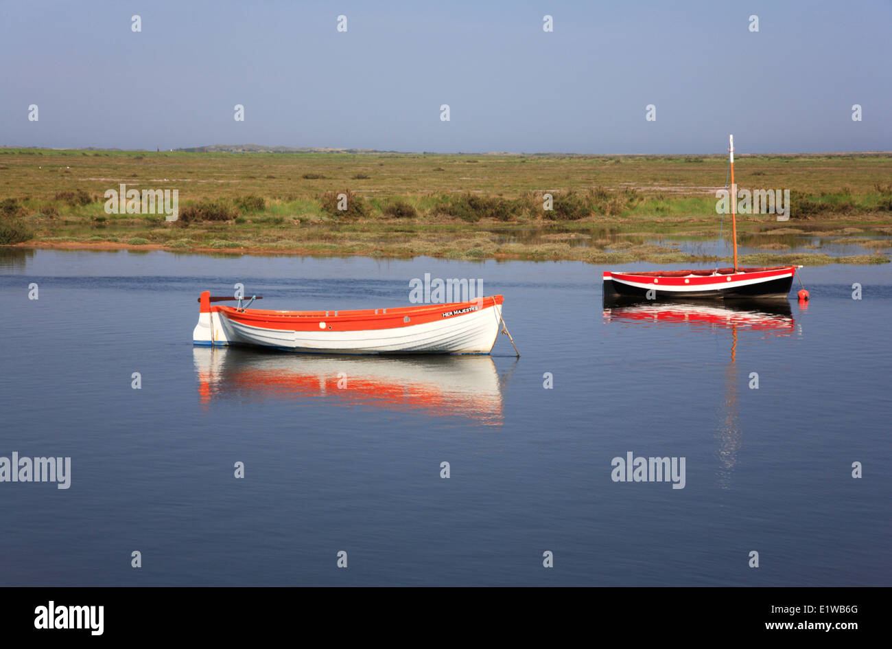 A view of two inshore fishing boats anchored in the creek at Burnham ...