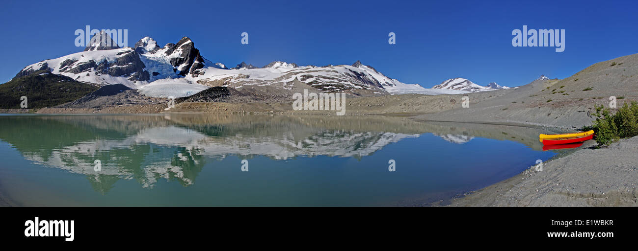 Canoes on Ape Lake near glacier, Chilcotin, Coast Mountains, British ...