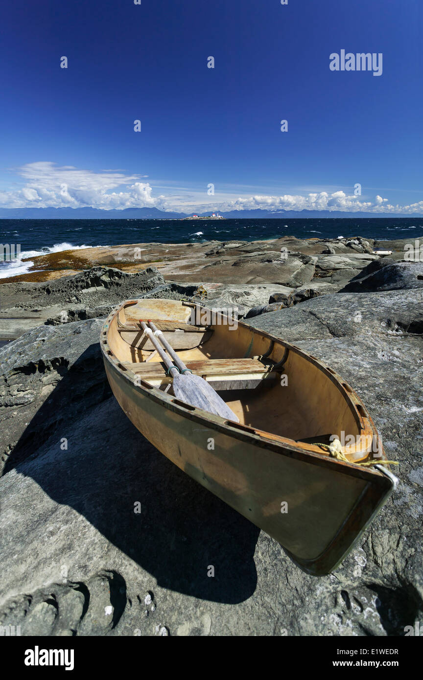 An abandoned dory comes to rest on sandstone rock formations on the ...