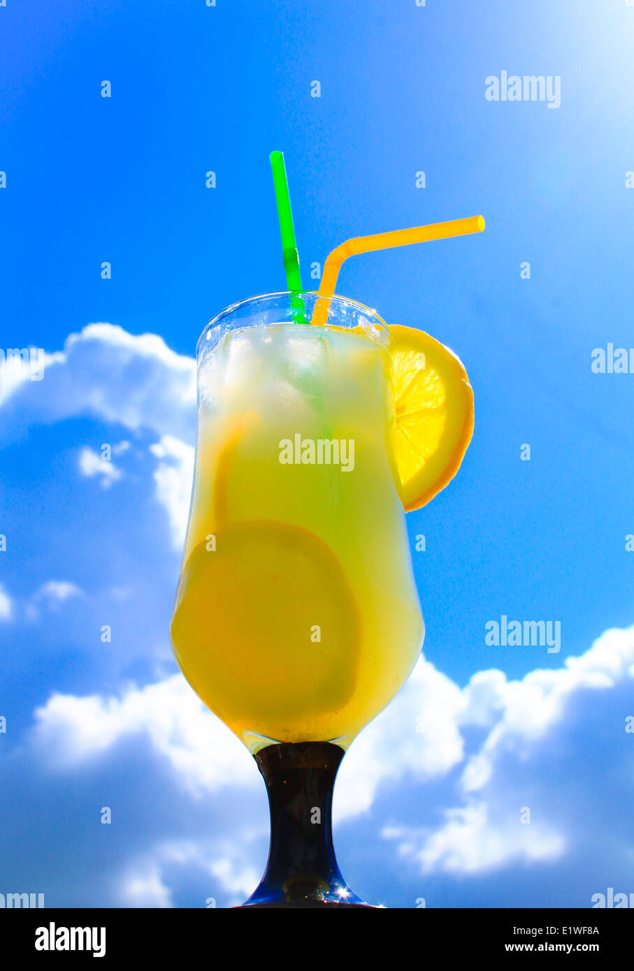 A glass of lemonade with a blue sky background Stock Photo - Alamy