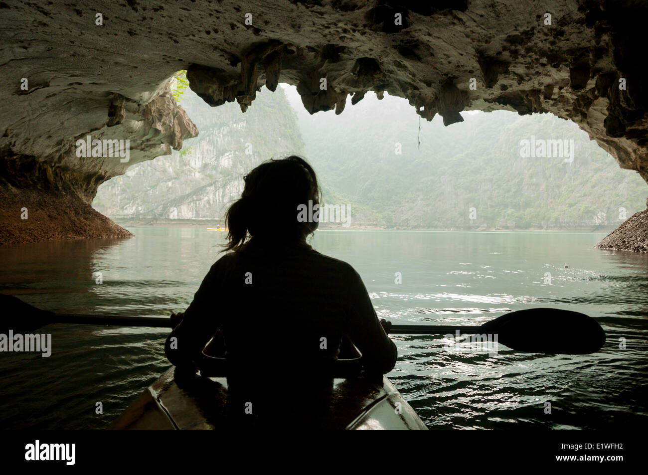 Kayaking through a rock arch in Lan Ha Bay, Vietnam Stock Photo - Alamy