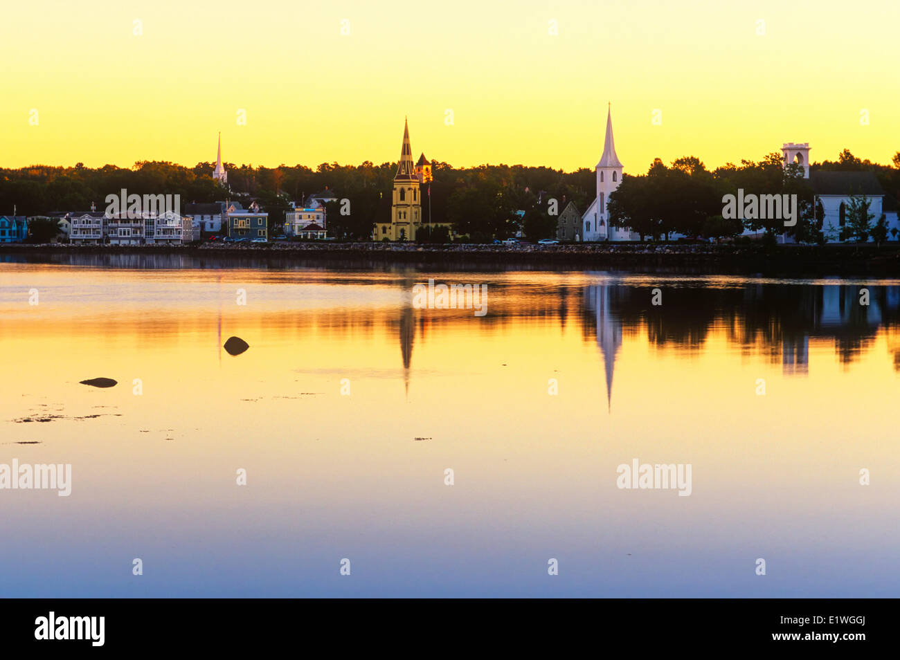 Churches reflected in waterfront at sunrise hi-res stock photography ...