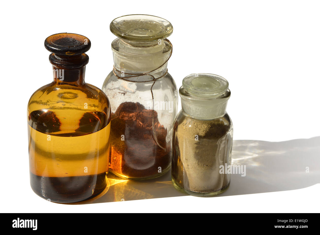 A set of chemical bottles with different content isolated on white ...