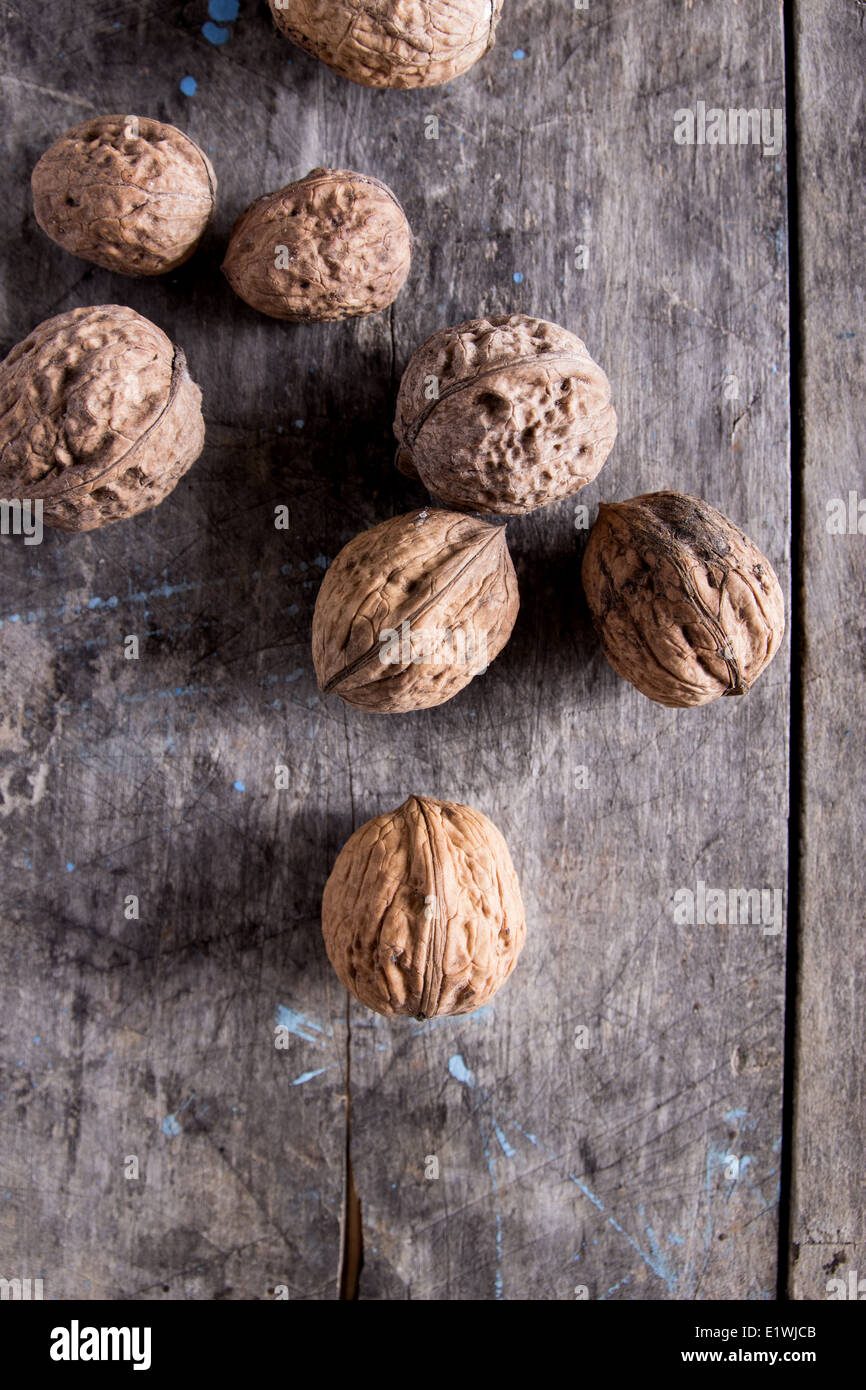 walnuts on rustic wooden texture, close up Stock Photo - Alamy