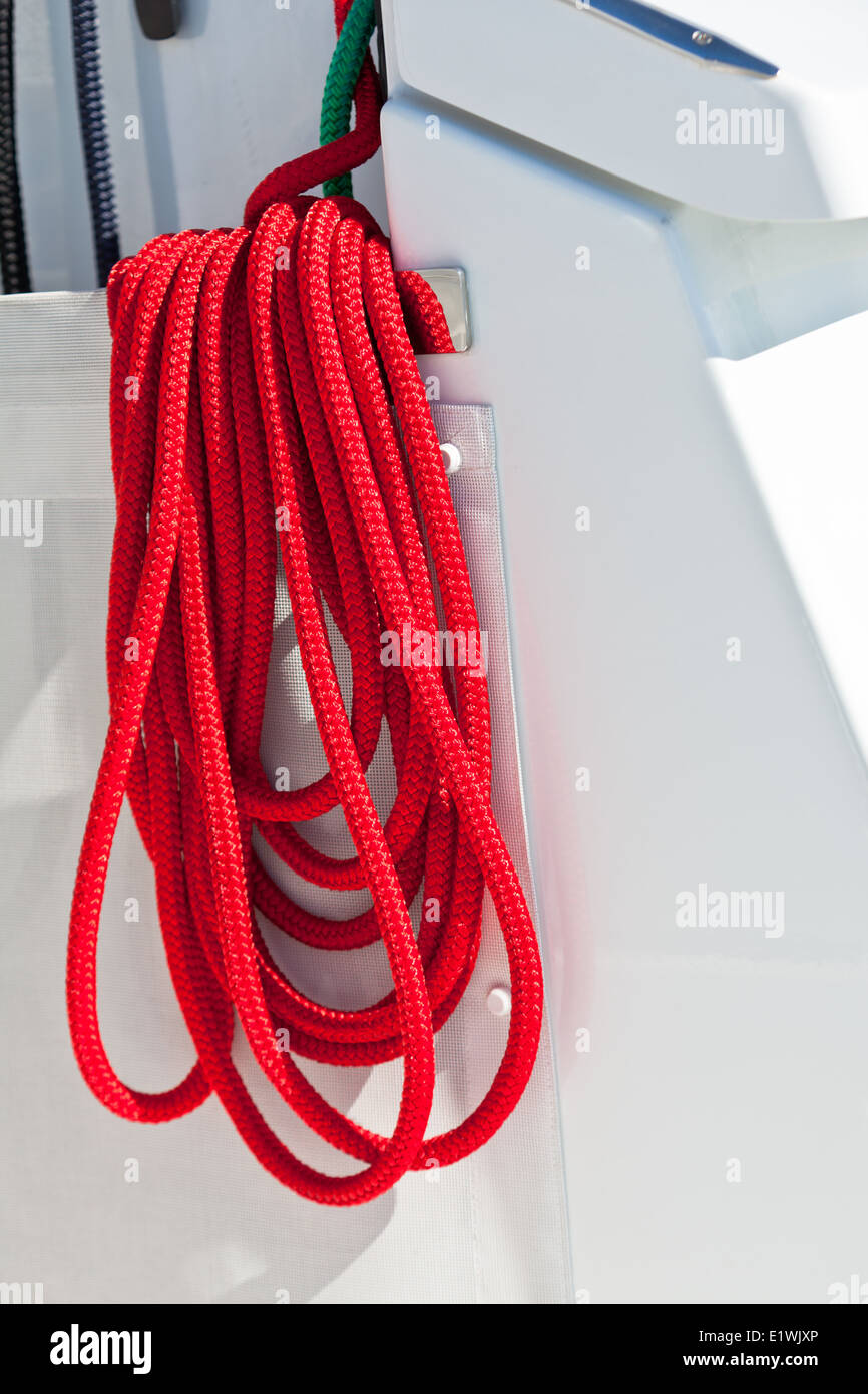 Details of sailing boat. Red ropes on white background Stock Photo - Alamy