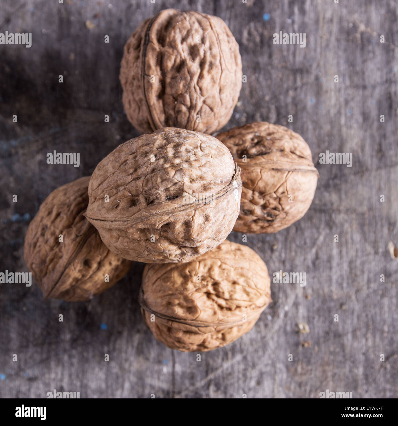 walnuts on rustic wooden texture, close up Stock Photo - Alamy
