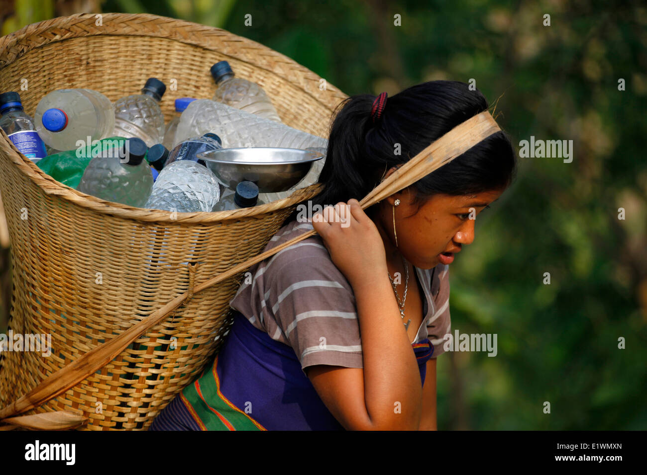 Indigenous people collect water from long distance Stock Photo - Alamy