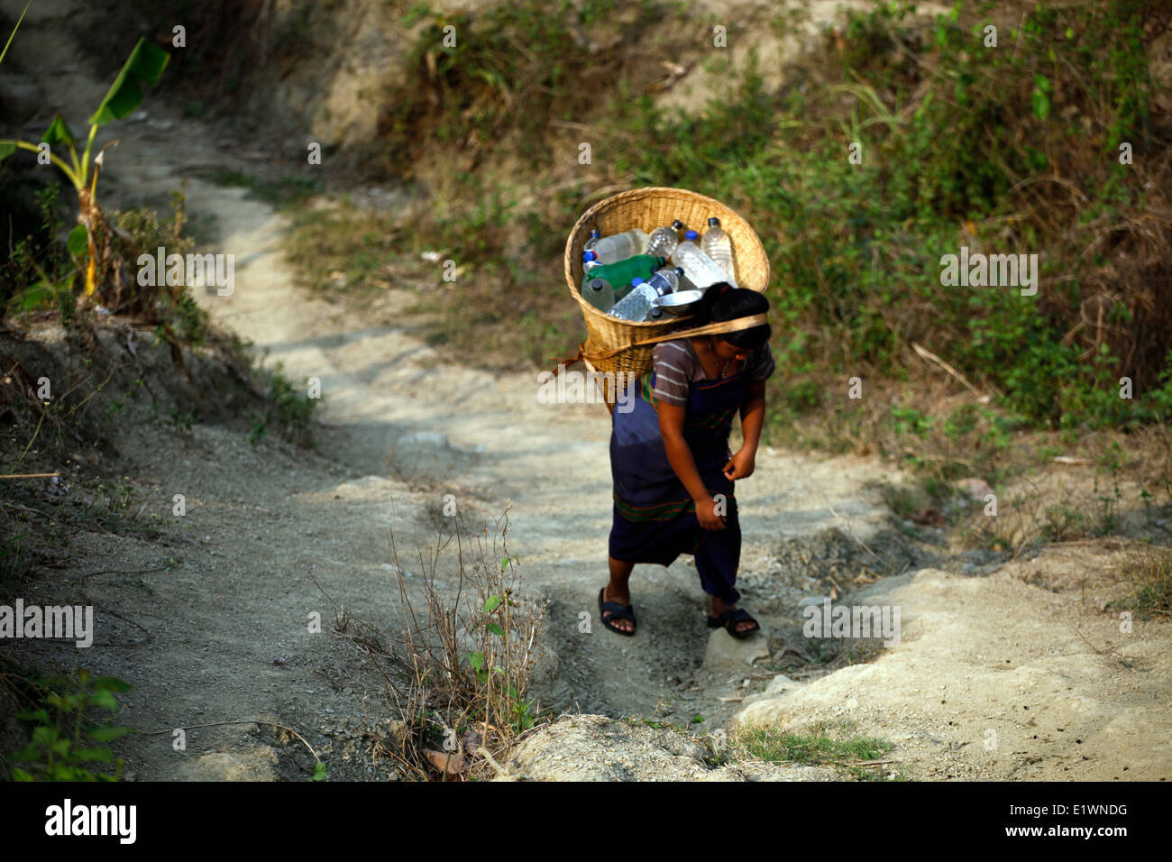 Indigenous people collect water from long distance Stock Photo - Alamy
