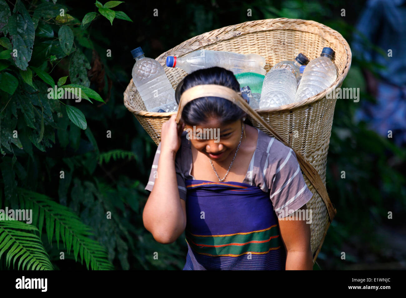 Indigeonus people collcet water from long distance Stock Photo - Alamy