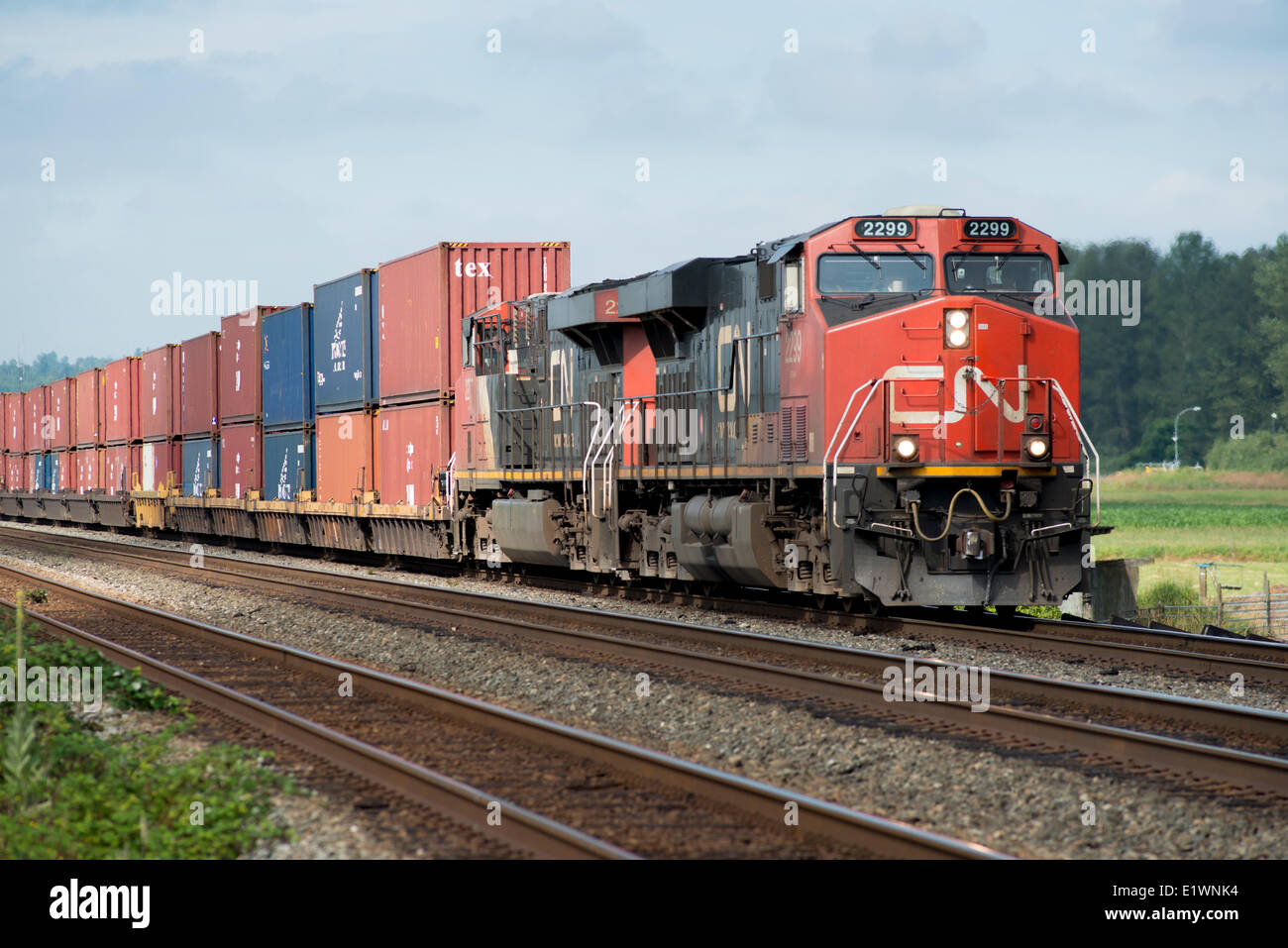 A CN (Canadian National Railway) container train eastbound through ... A CN (Canadian National Railway) container train eastbound through ...