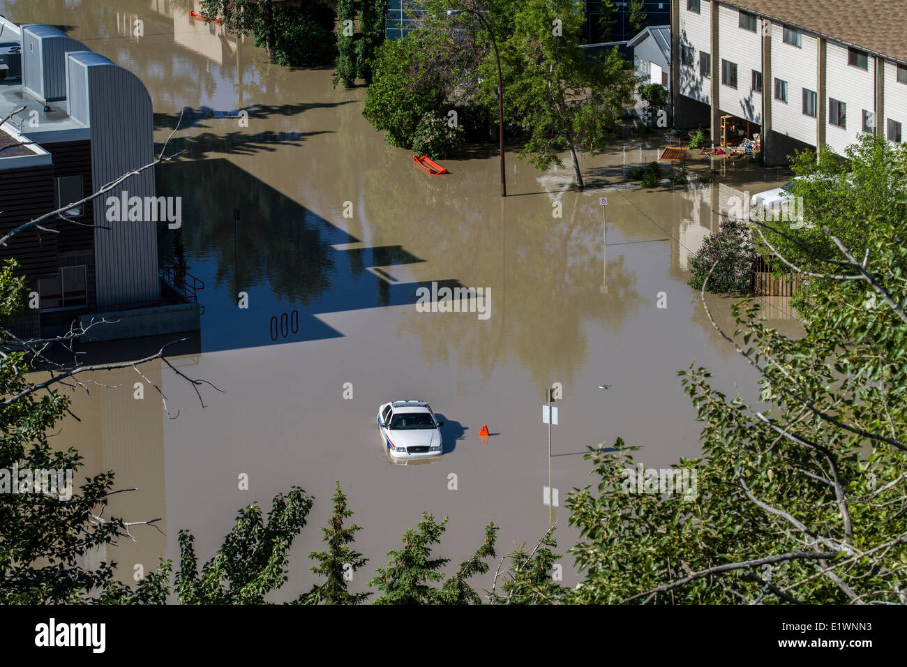 Calgary June 2013 Flood. Flooded rear apartment building with flooded ...