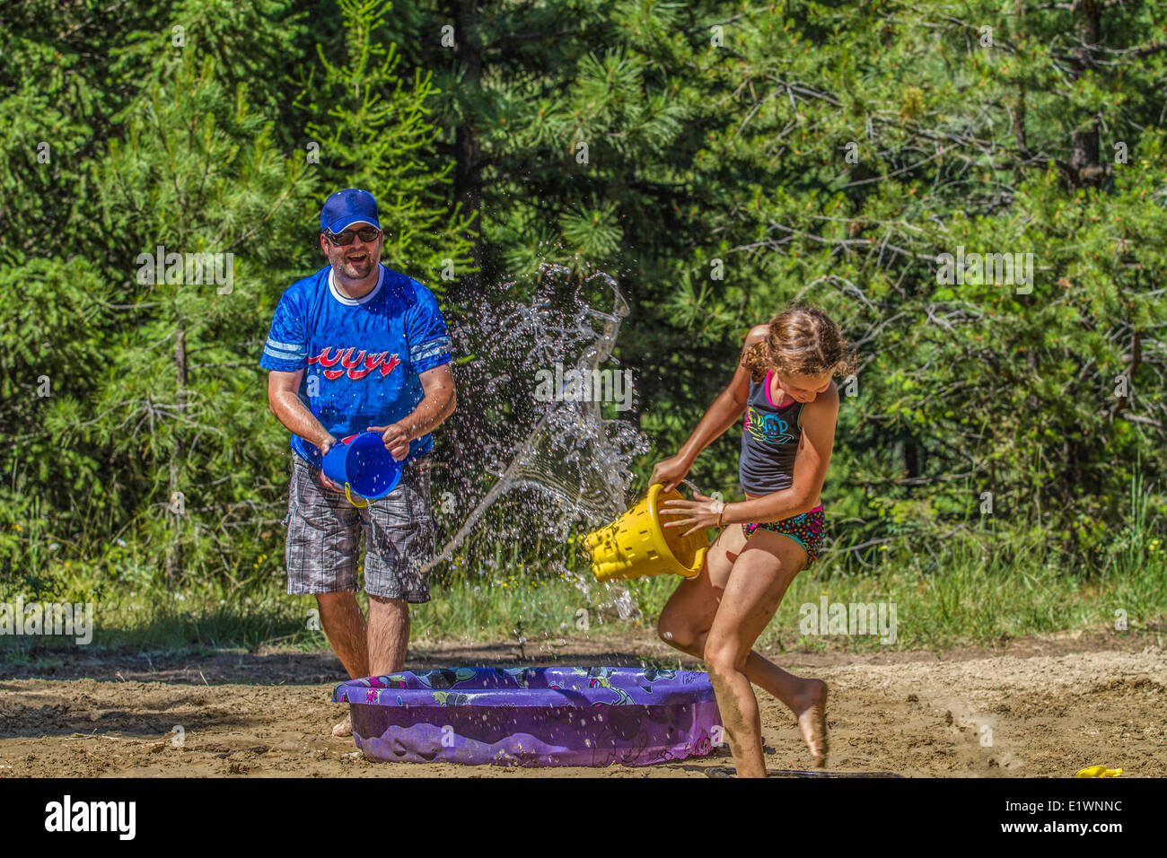 Pool water water fight hi-res stock photography and images - Alamy