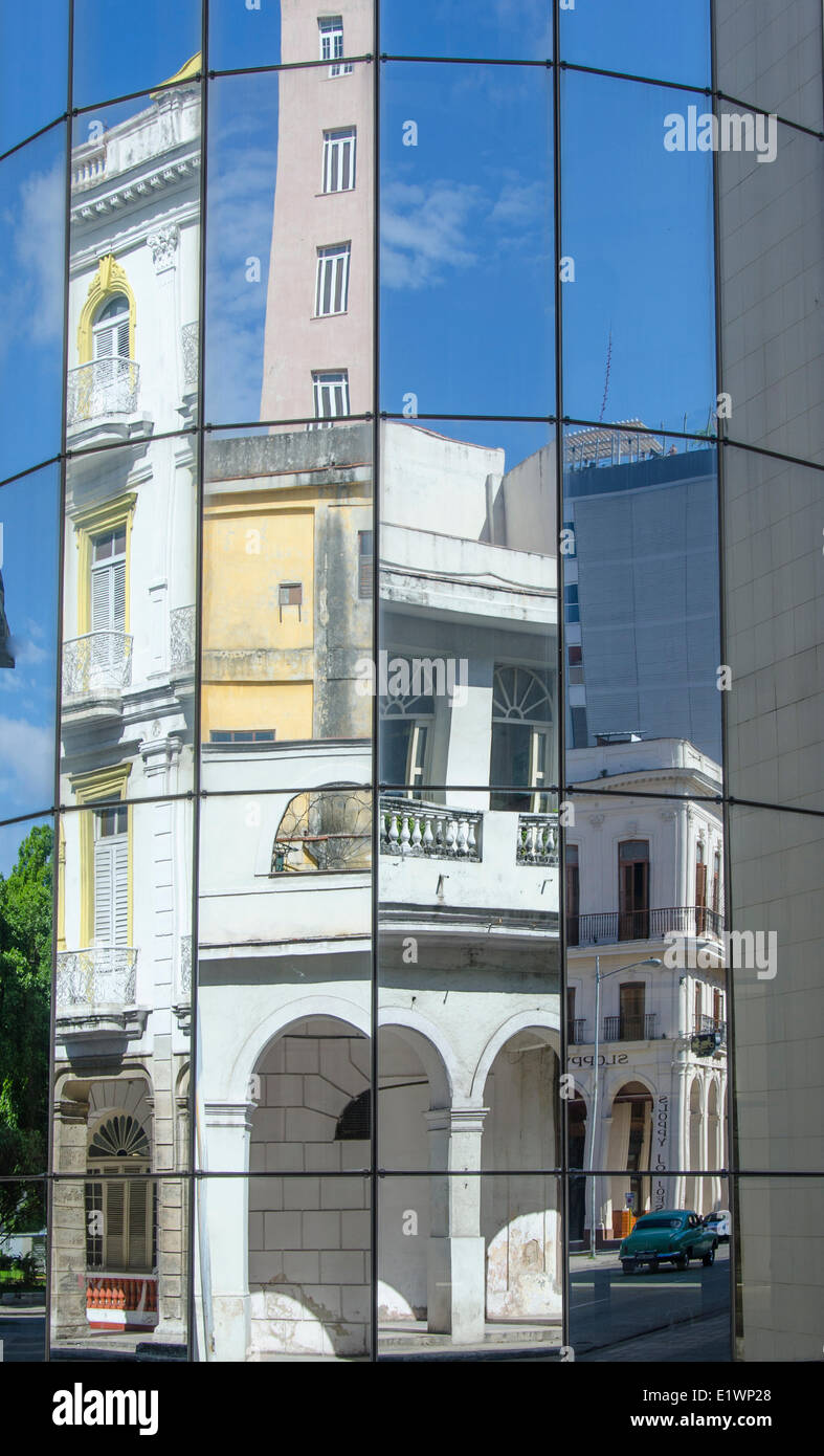 Old American Car reflected in angled glass building, Havana, Cuba Stock ...