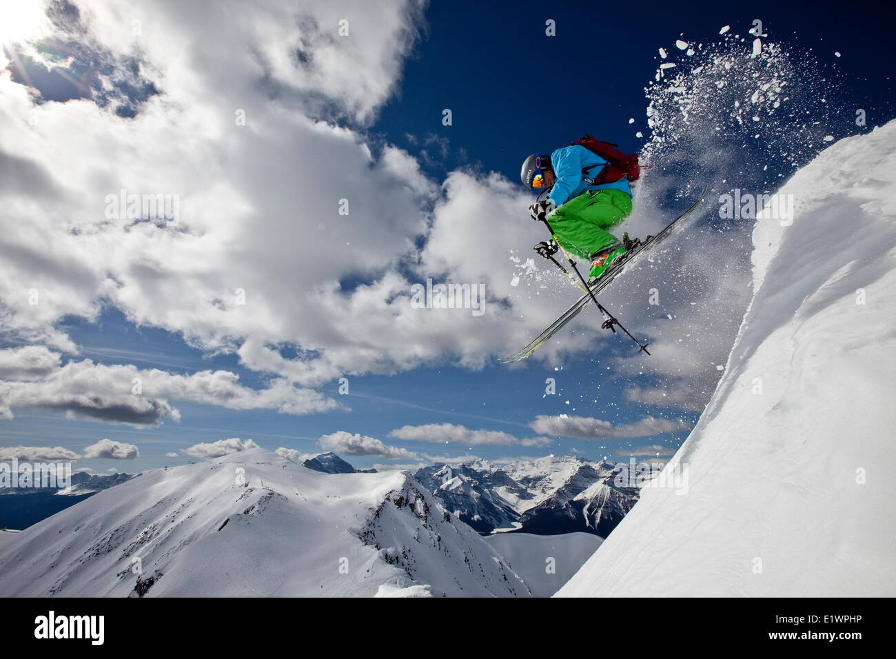 Young male skier catches air at lake louise ski resort hi-res stock ...