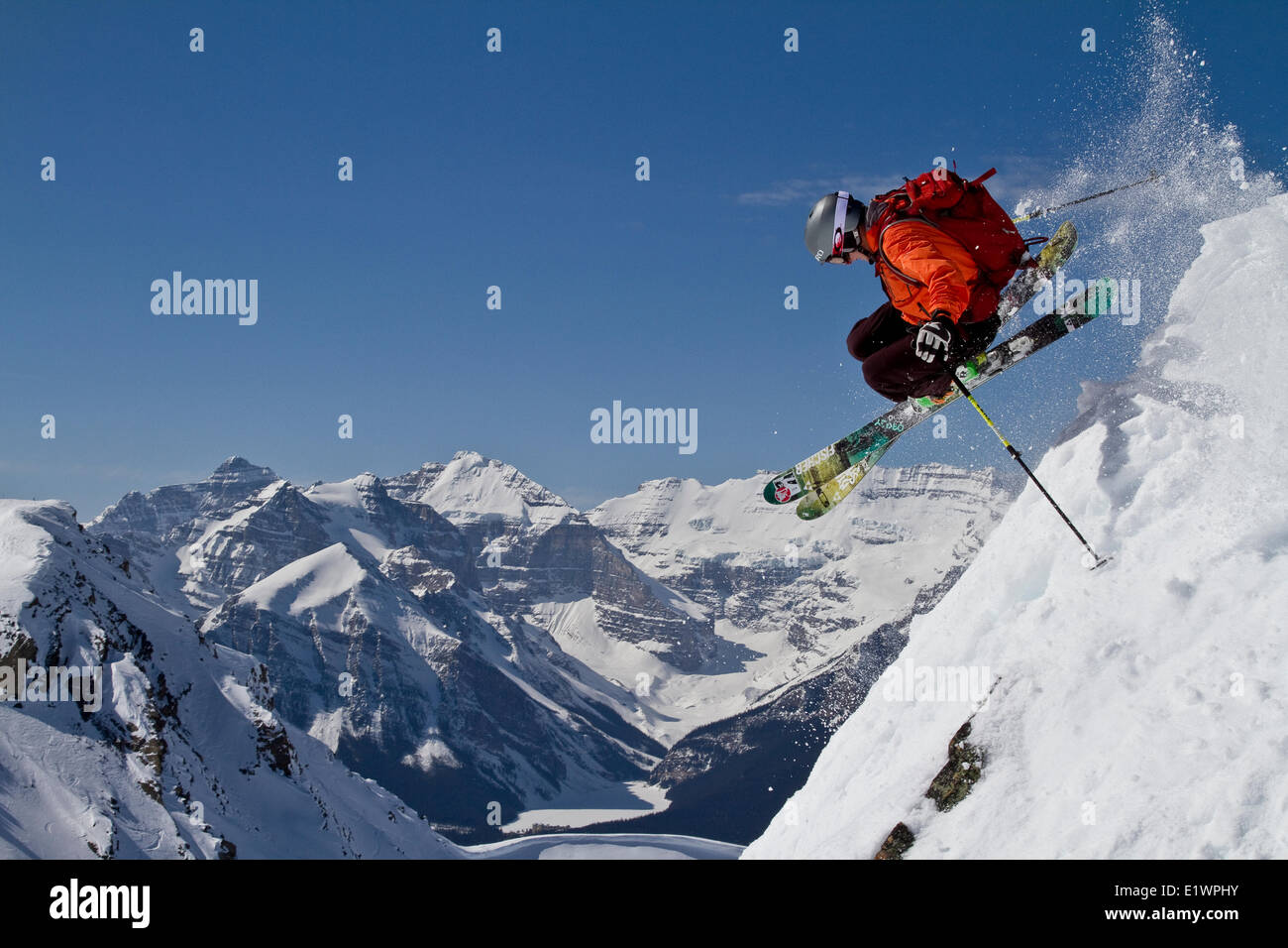 Young male skier catches air at lake louise ski resort hi-res stock ...