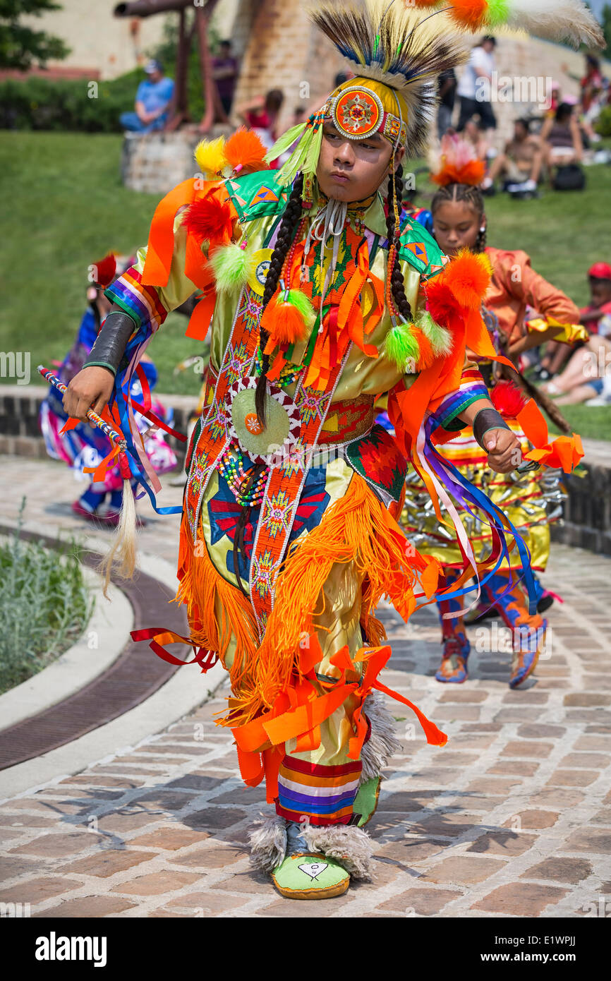 First Nations dancers in traditional dress at a pow wow ceremony ...