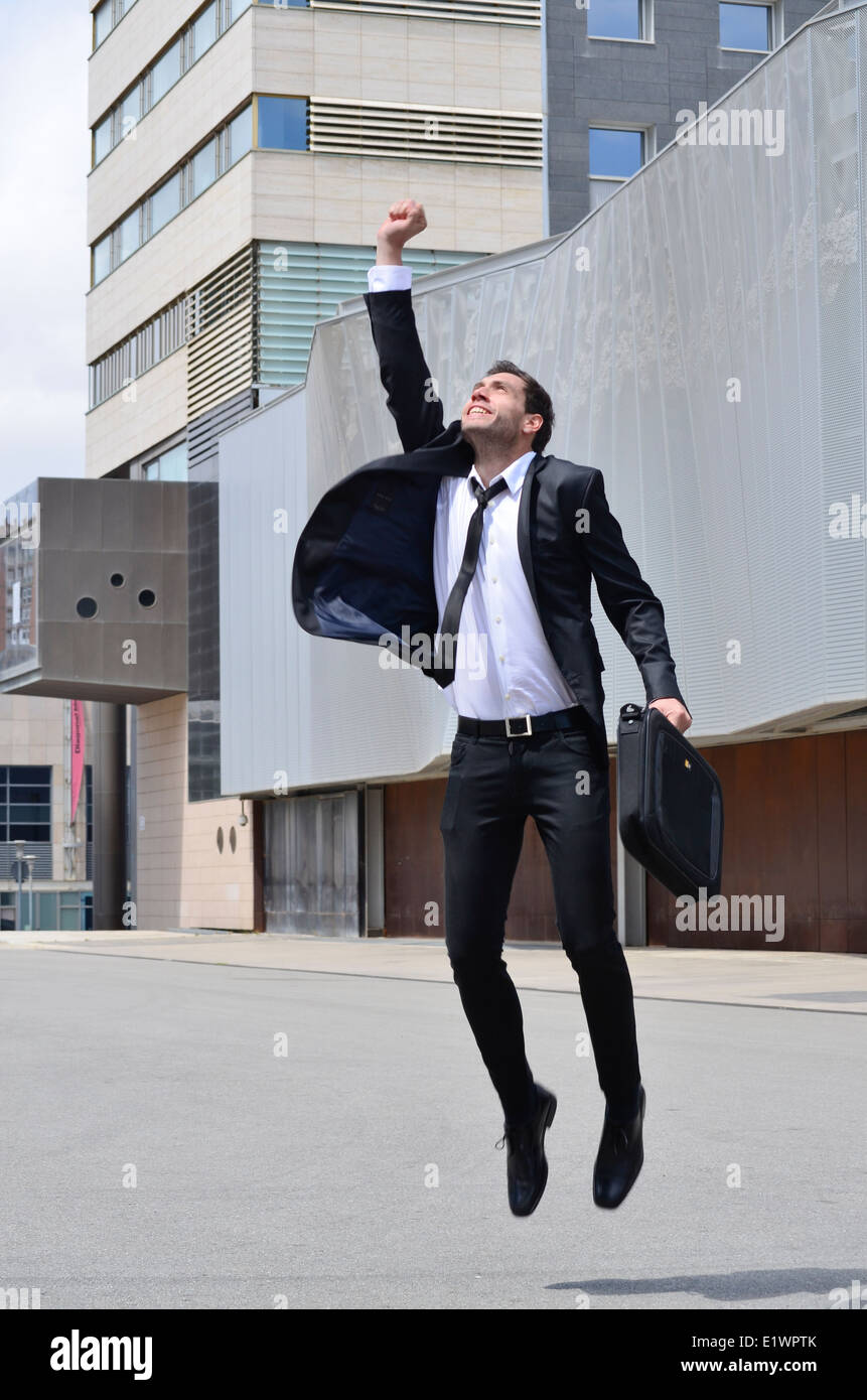 Happy businessman flying Stock Photo - Alamy
