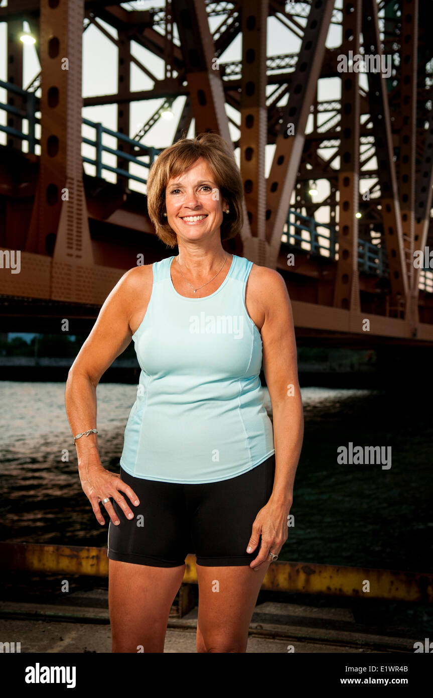 Attractive woman in her 50's in athletic wear Stock Photo - Alamy