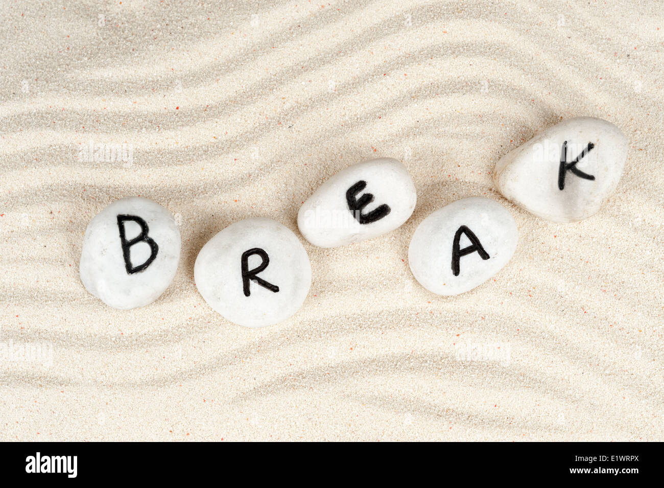 Break word on group of pebbles Stock Photo - Alamy