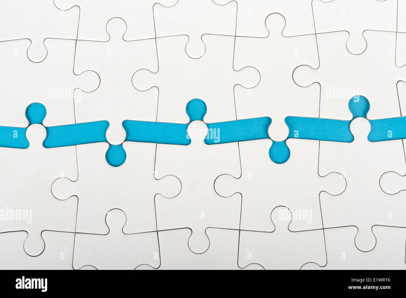 Group of white paper jigsaw puzzles Stock Photo - Alamy