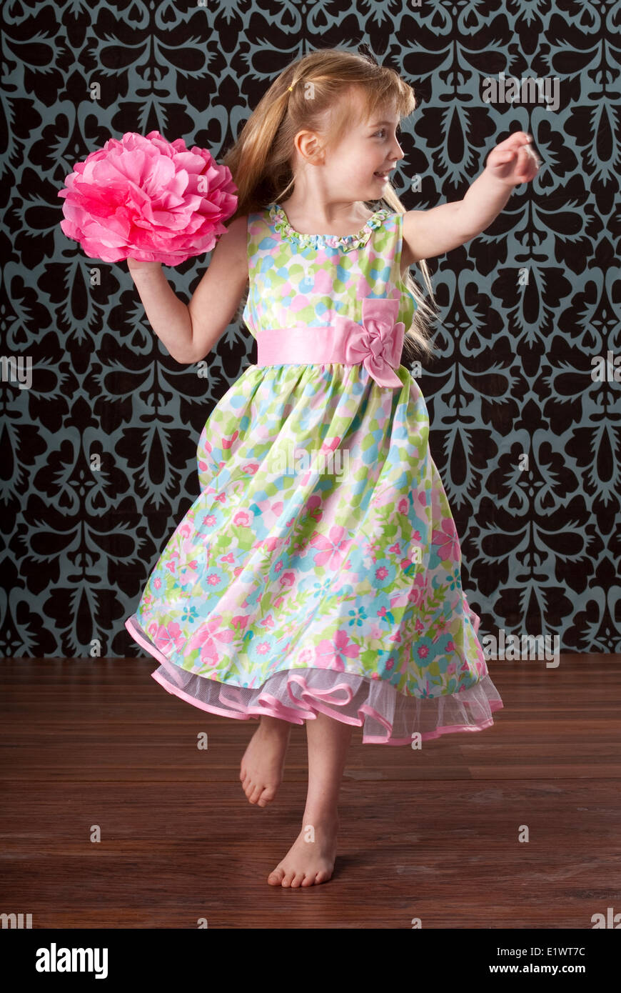 young girl dancing with paper flower Stock Photo - Alamy