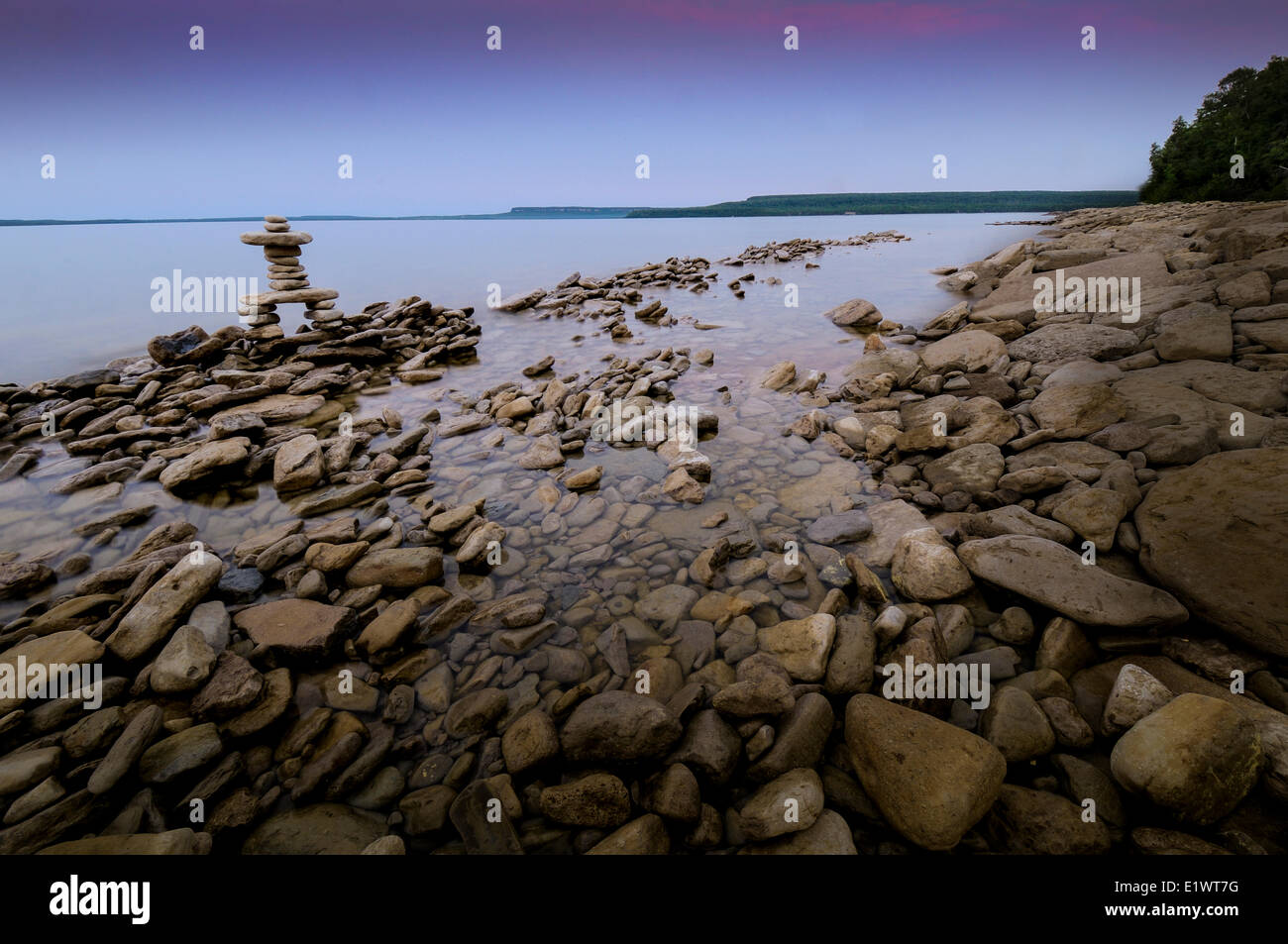 Calm Lakeshore in Canada with Inukshuk Stock Photo - Alamy