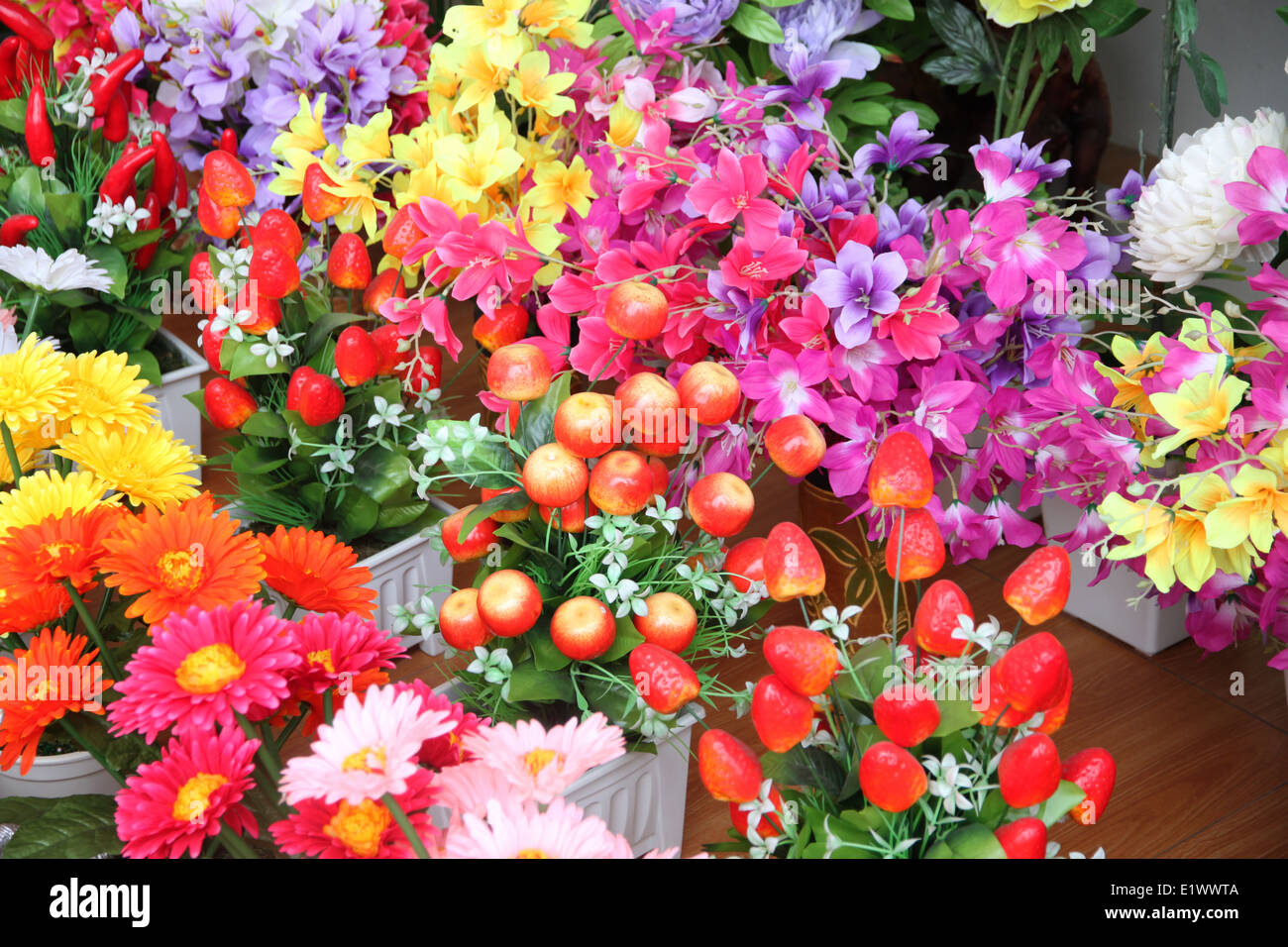 Colorful of artificial flowers for background Stock Photo - Alamy