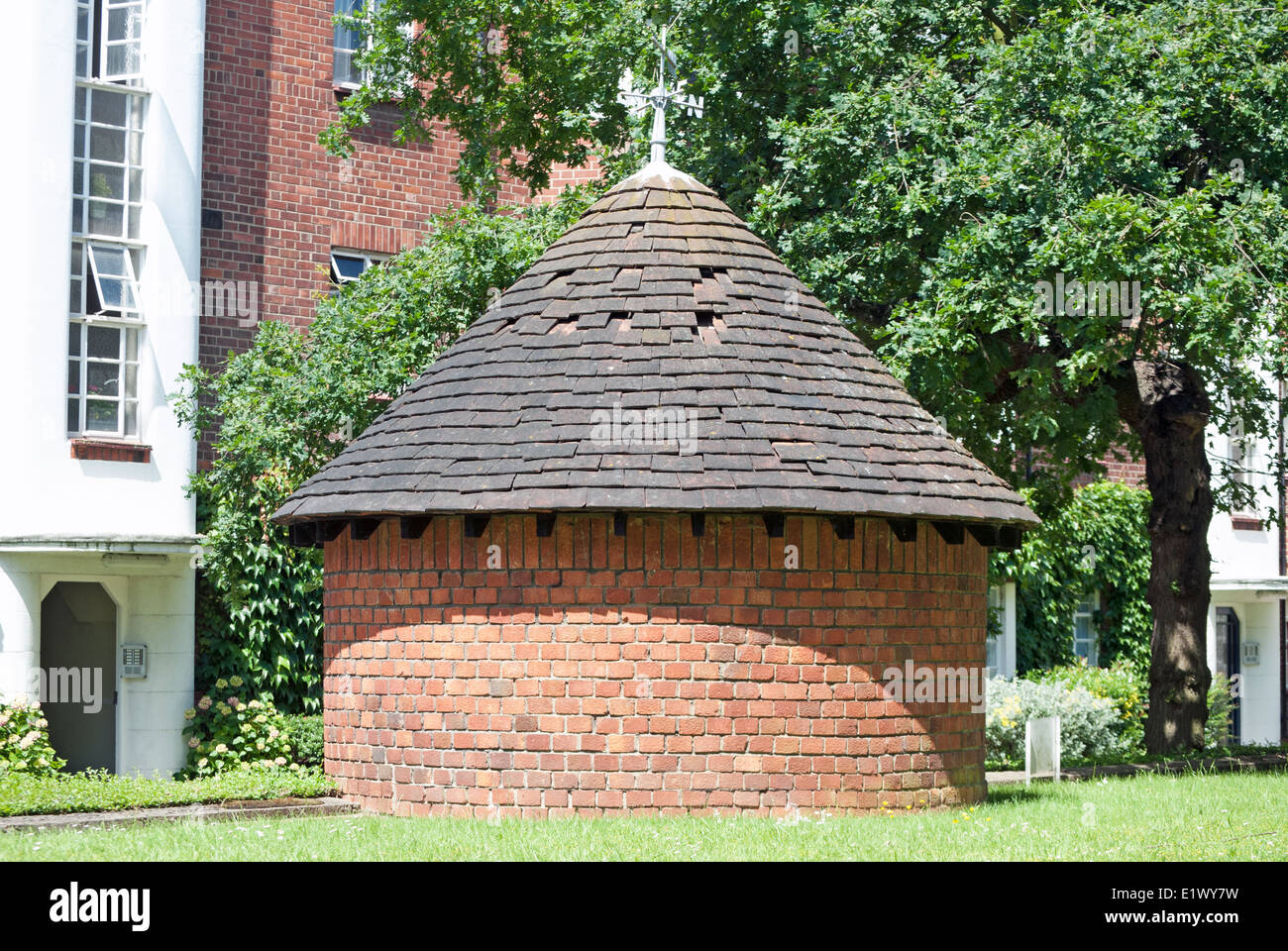 circular building with tiled roof covering the entrance to a communal ...