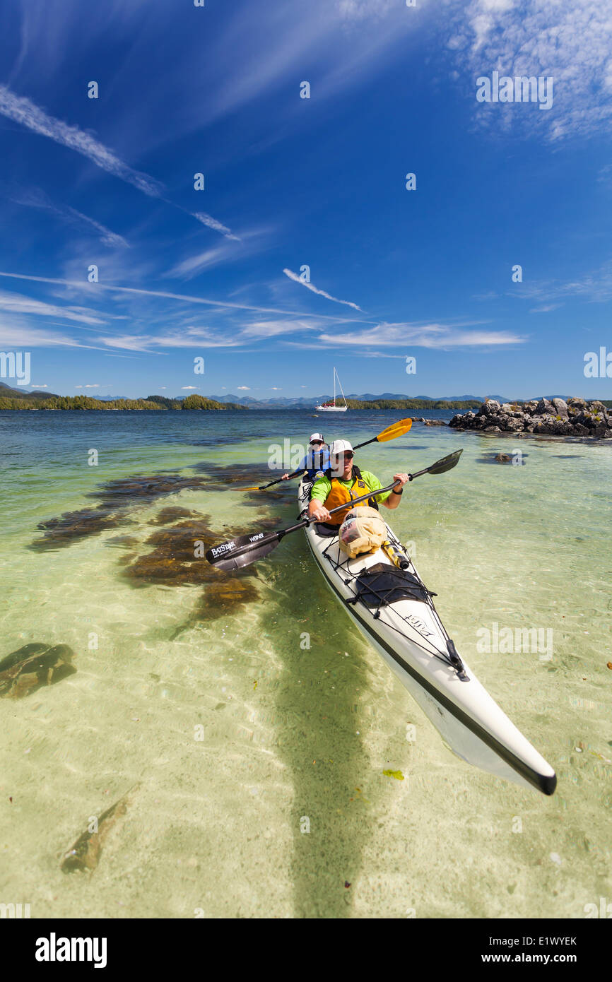 A couple paddles ashore on Hand Island located within the Broken Island ...