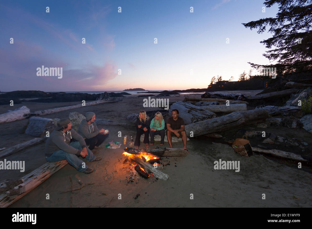 Friends gather around a fire for snacks conversation on Chesterman ...
