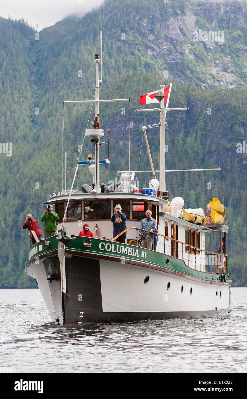 Photographers aboard Columbia III prepare to photograph a waterfall ...