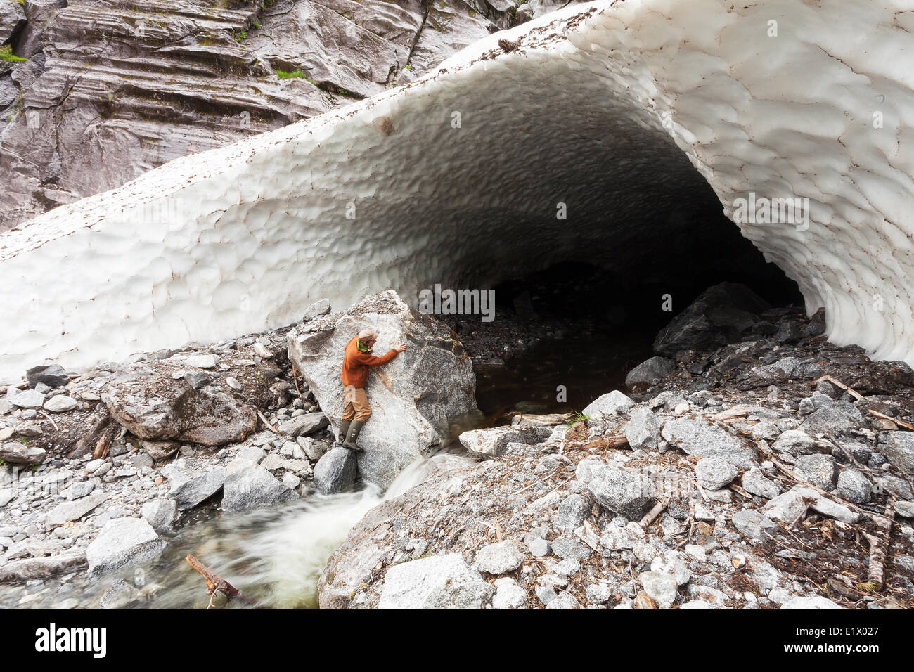 A guide checks out a melting Ice Cave late in the season in Kynoch ...