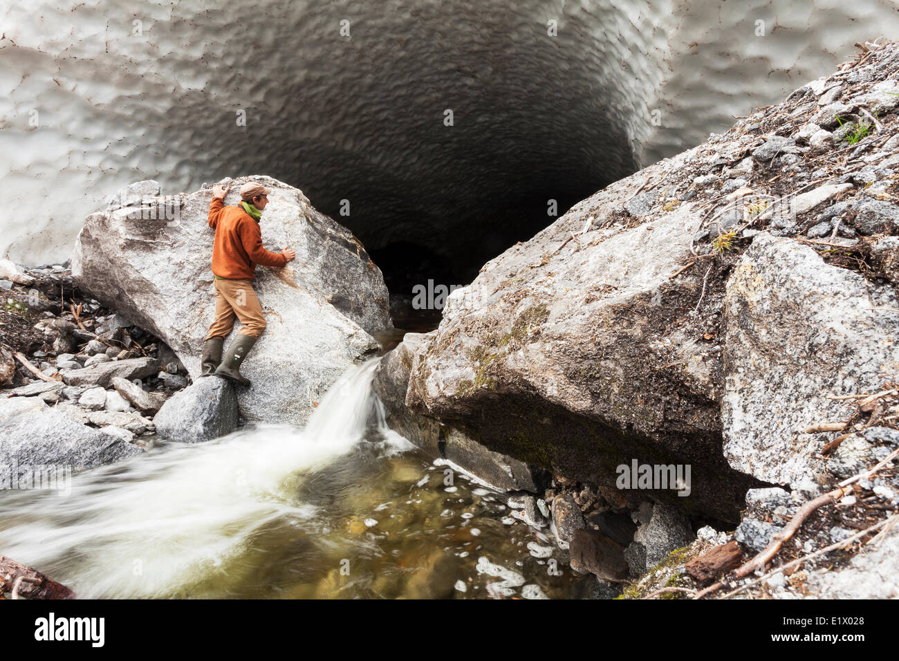 A guide checks out a melting Ice Cave late in the season in Kynoch ...