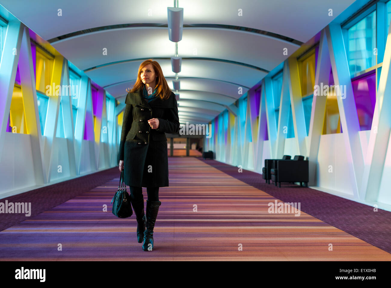 business woman walking trough hallway Stock Photo - Alamy