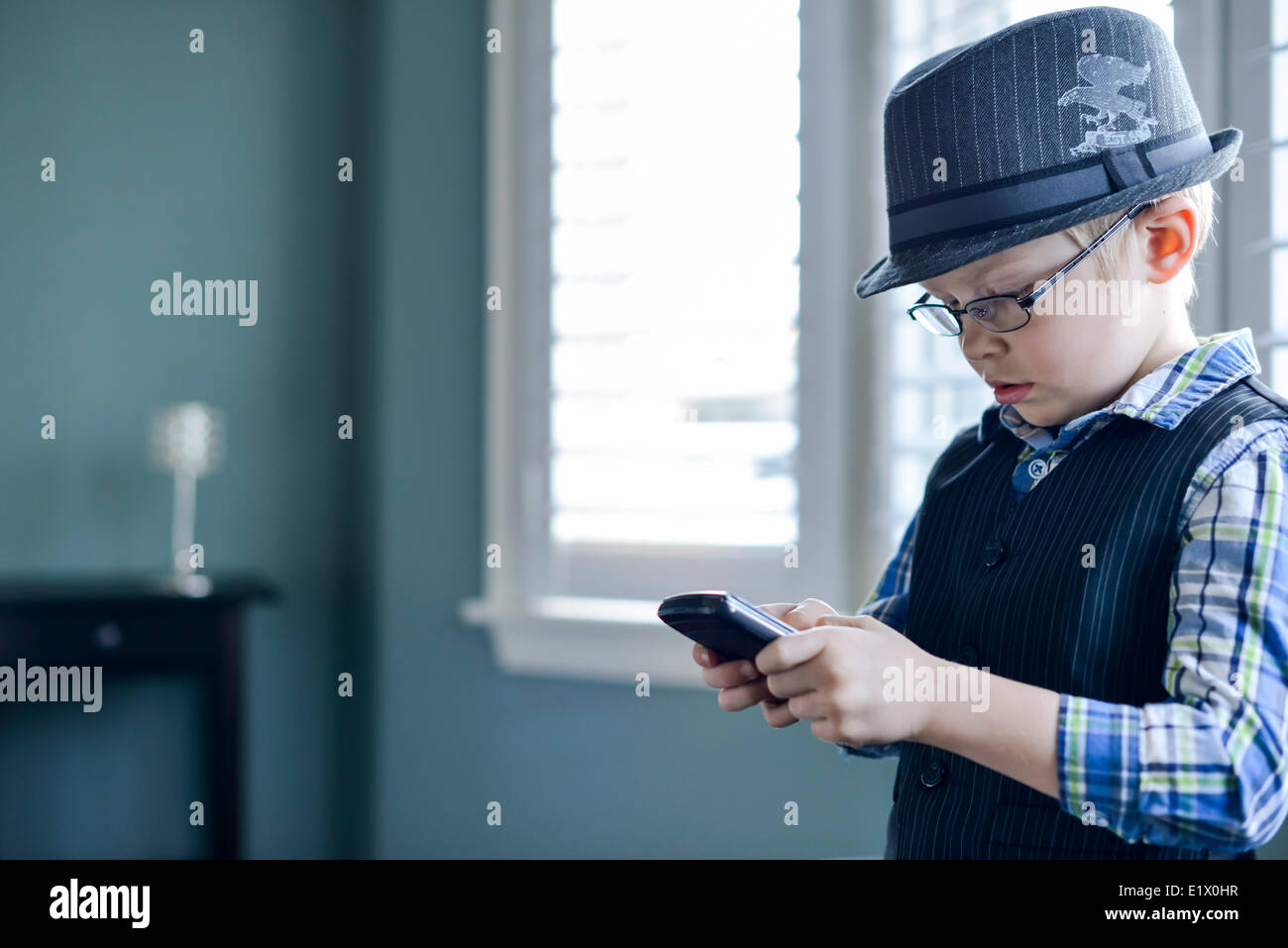 Young boy playing games on a cellphone Stock Photo - Alamy