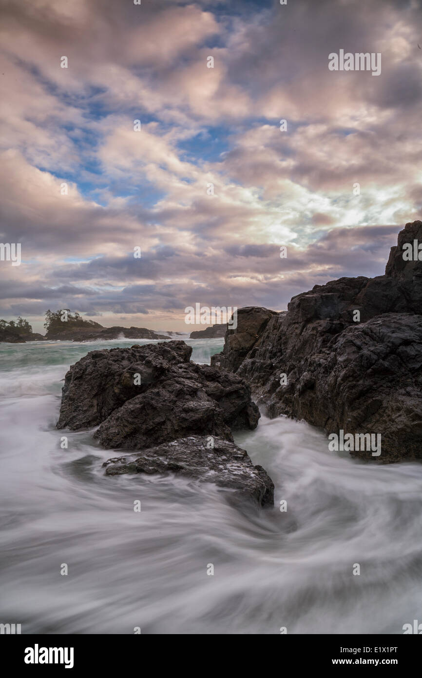 Water flows around the rocks of South Beach as high tide approaches ...