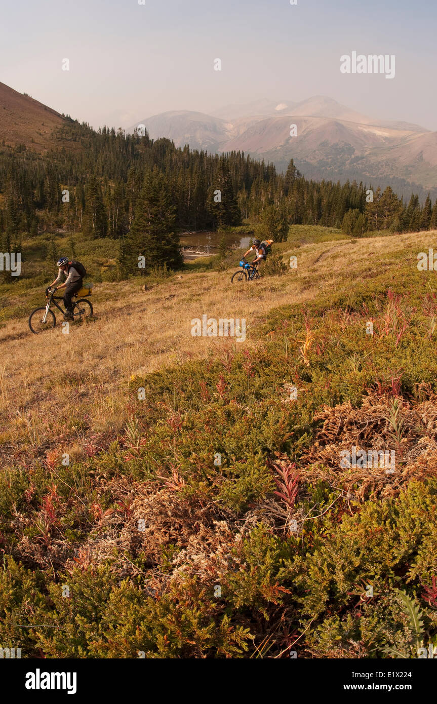 Mountain bike touring in Elbow Pass. Spruce Lake Protected Area, South ...
