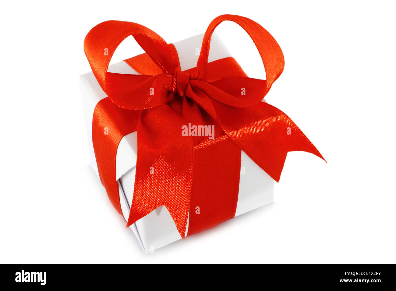 White box with red bow on a white background Stock Photo - Alamy