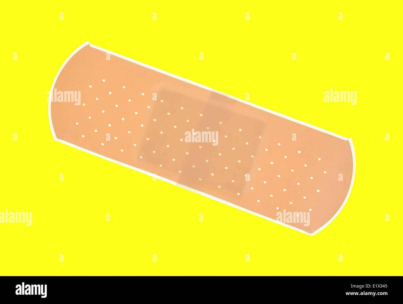 A single sticky first aid bandage on a yellow background Stock Photo ...