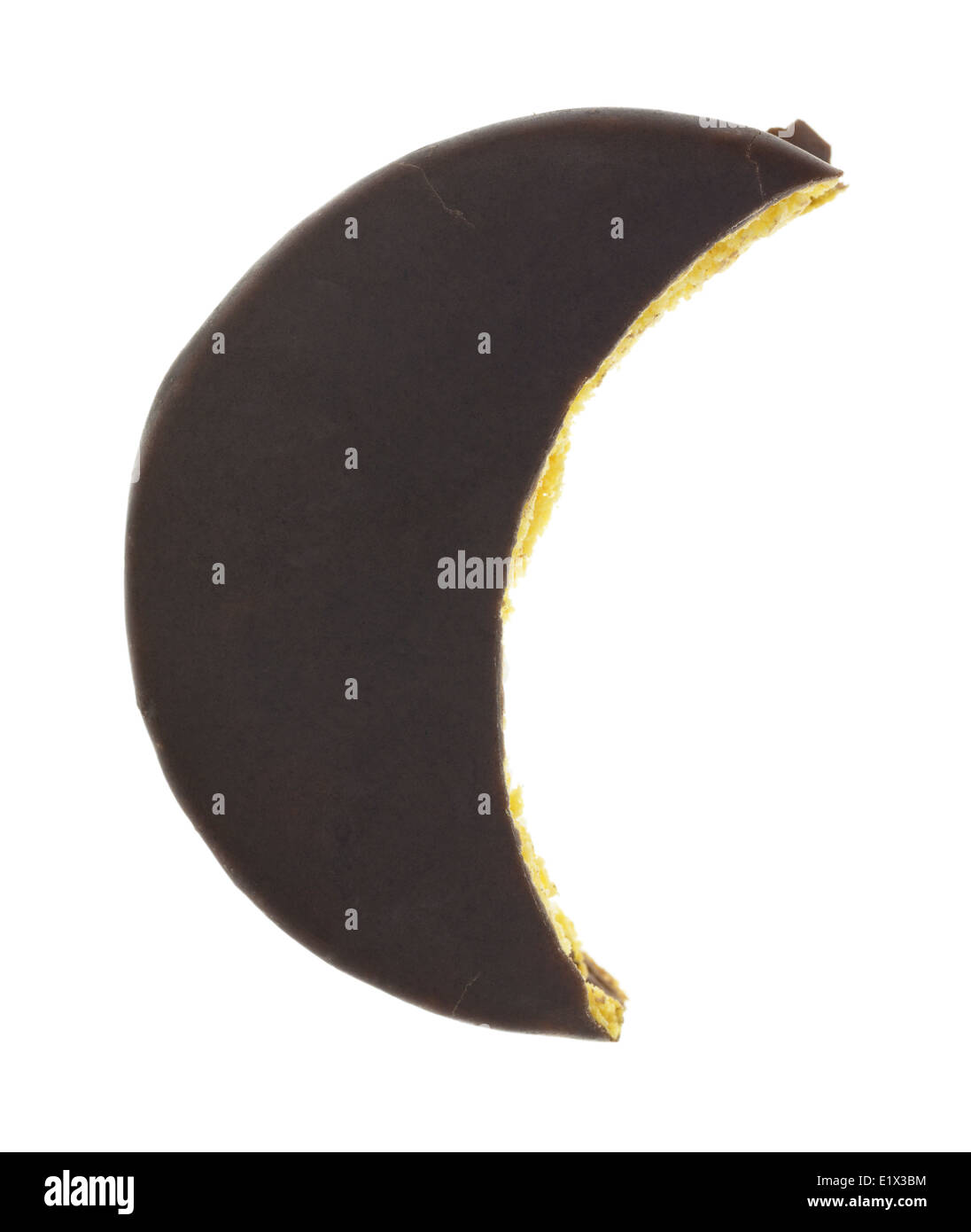 A chocolate pie dessert in the shape of a crescent moon on a white ...