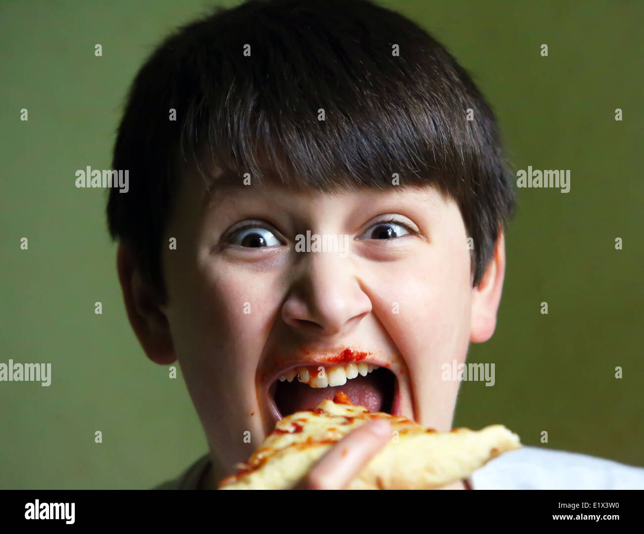 Funny Boy Eating Pizza Stock Photo - Alamy