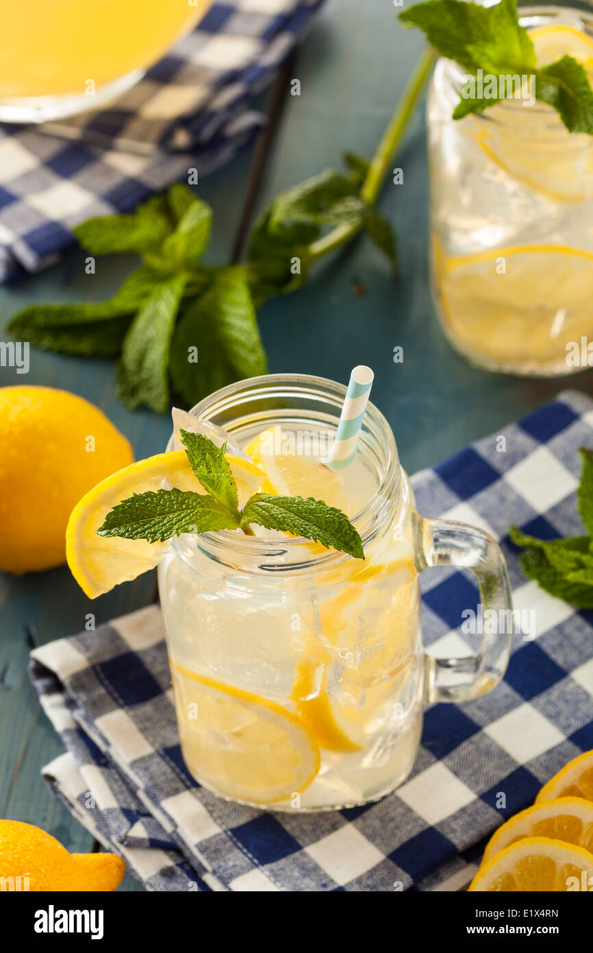 Homemade Refreshing Yellow Lemonade with Ice and Mint Stock Photo - Alamy
