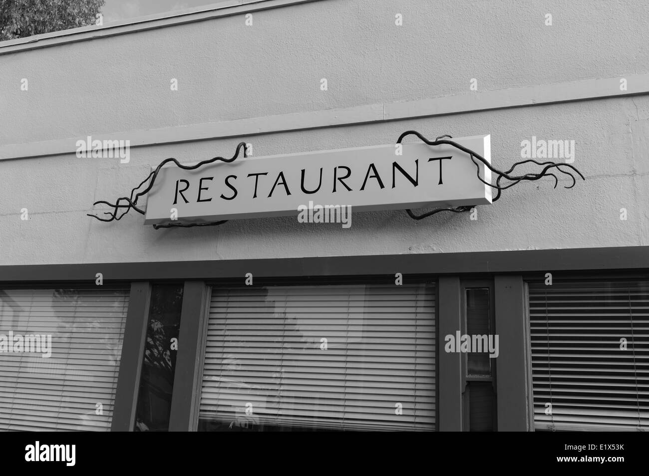Restaurant sign on wood rectangle placed above doorway Stock Photo - Alamy