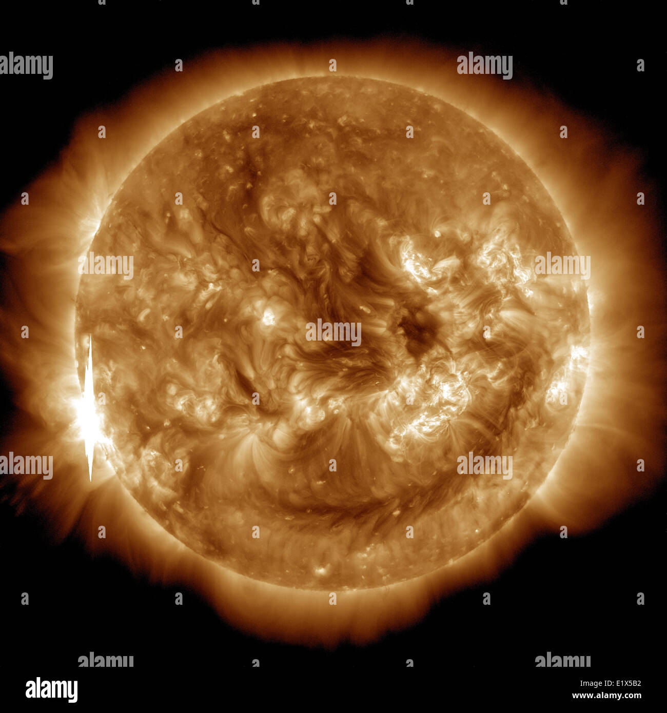 A significant X-class solar flare explodes on the left side of the sun ...