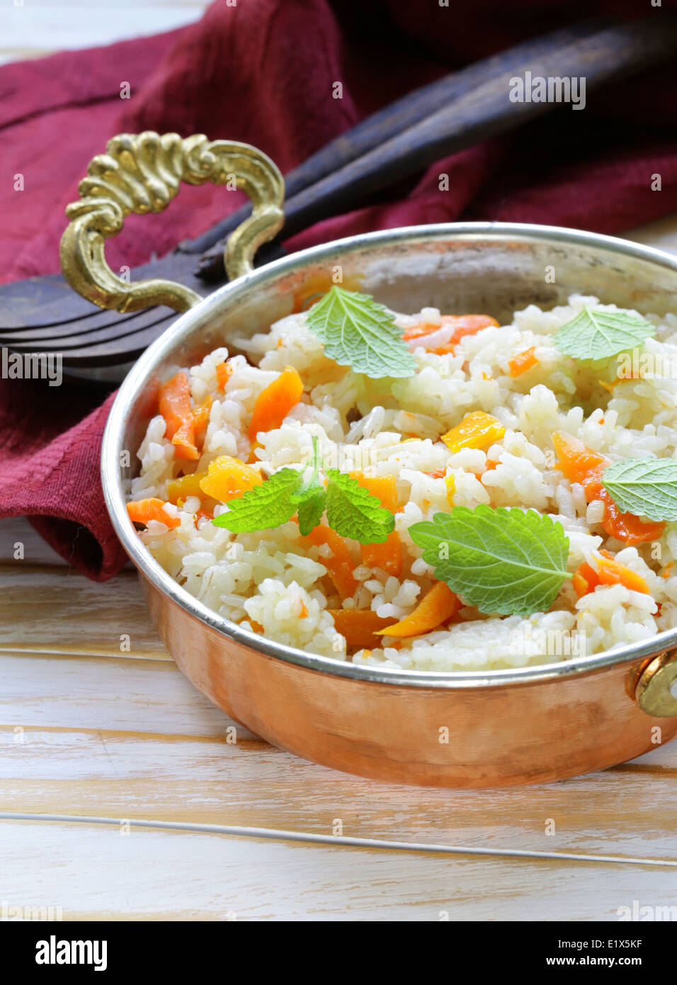 rice with vegetables cooked in Indian style in a copper pan Stock Photo ...